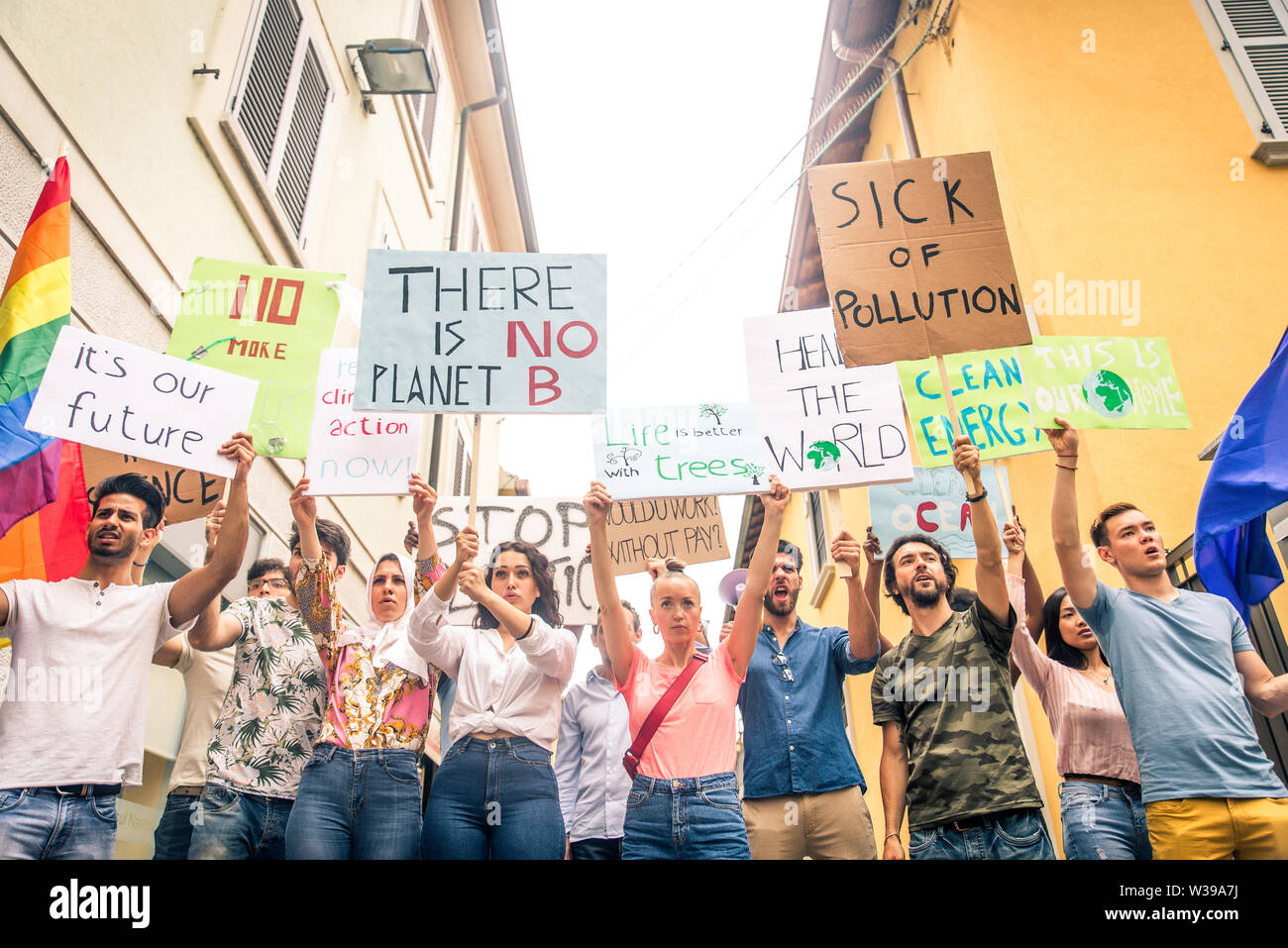 Group of activists is protesting outdoors - Crowd demonstrating against ...