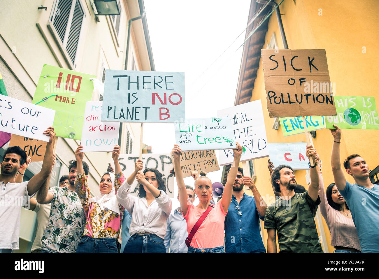 Group of activists is protesting outdoors - Crowd demonstrating against ...