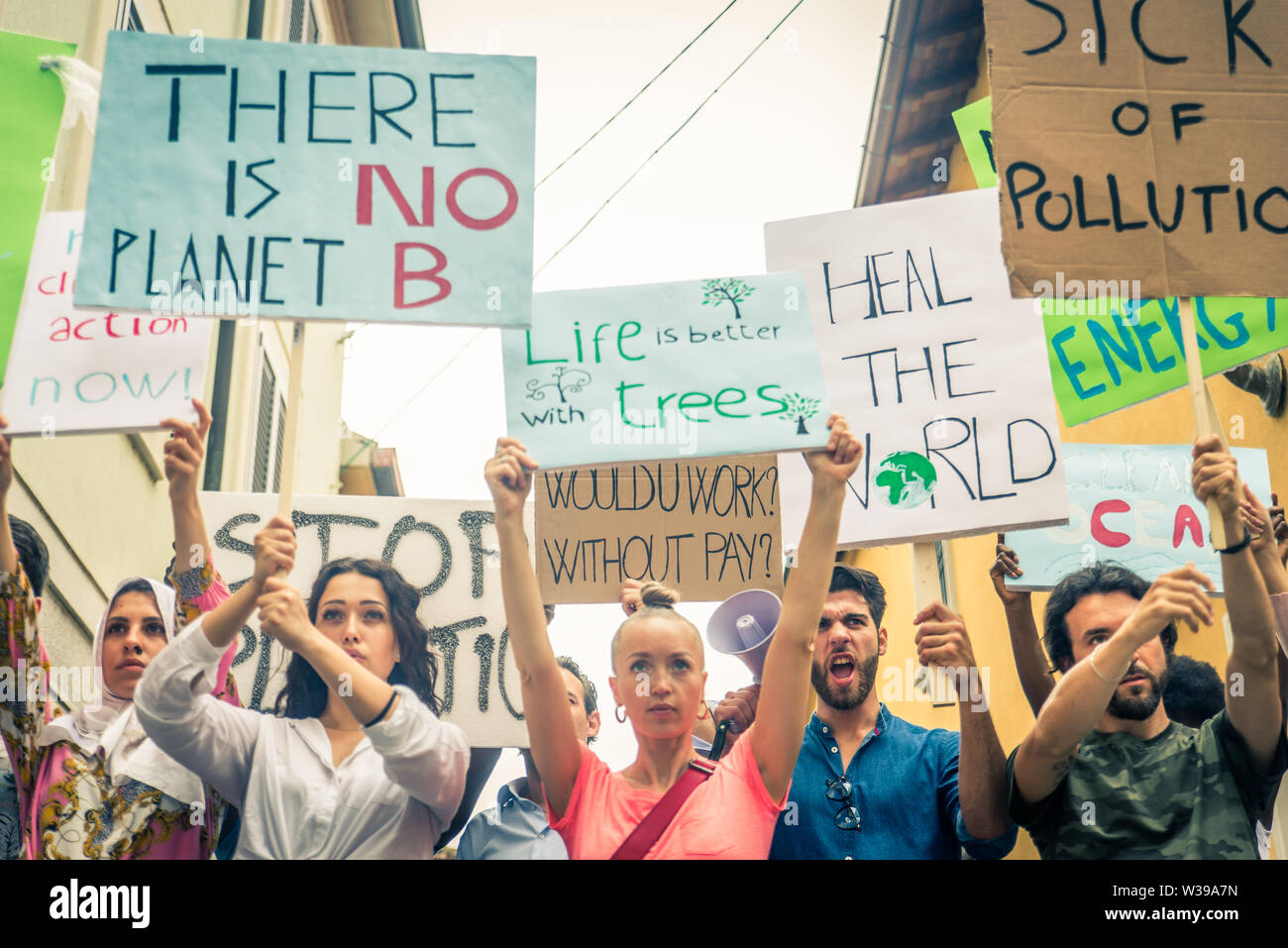 Group of activists is protesting outdoors - Crowd demonstrating against ...