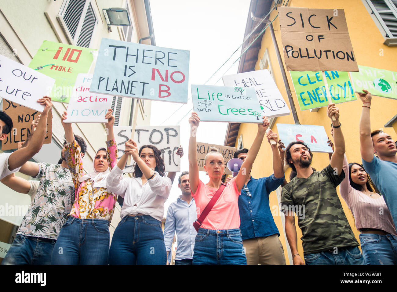 Group of activists is protesting outdoors - Crowd demonstrating against ...