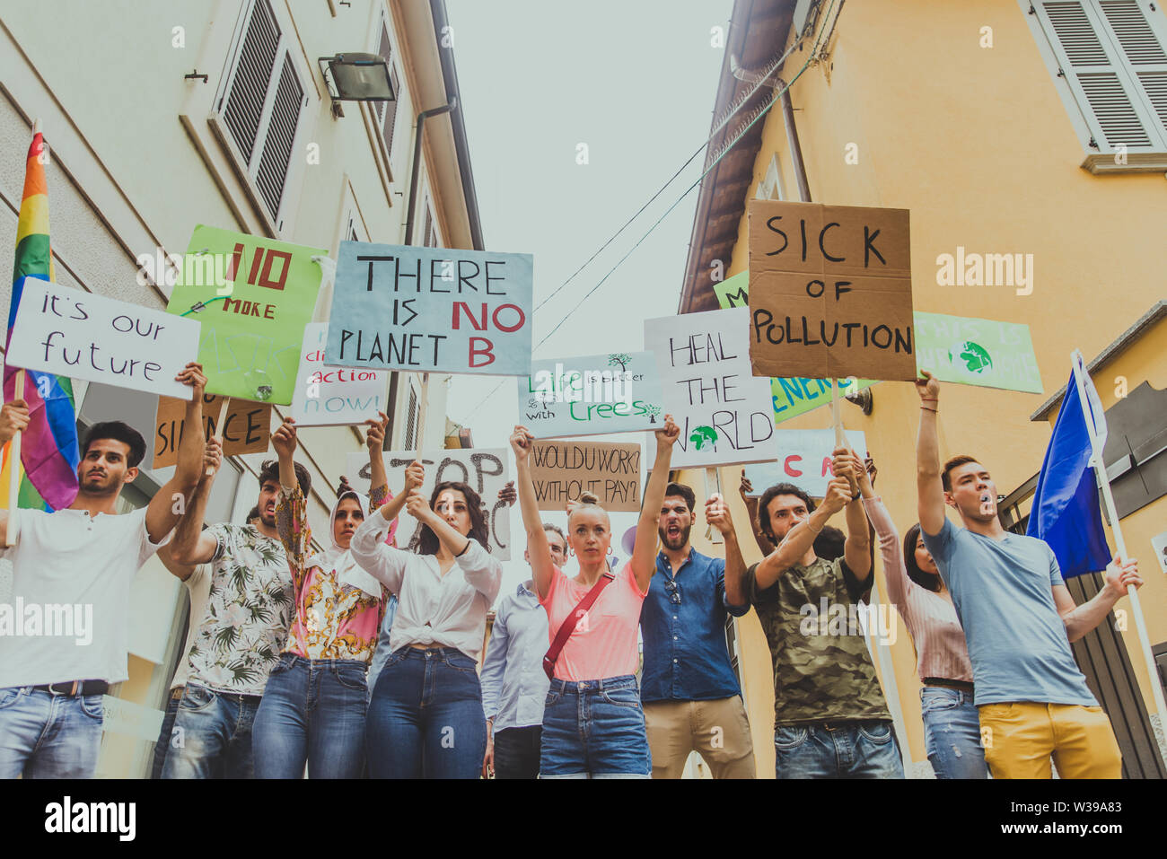 Group of activists is protesting outdoors - Crowd demonstrating against ...