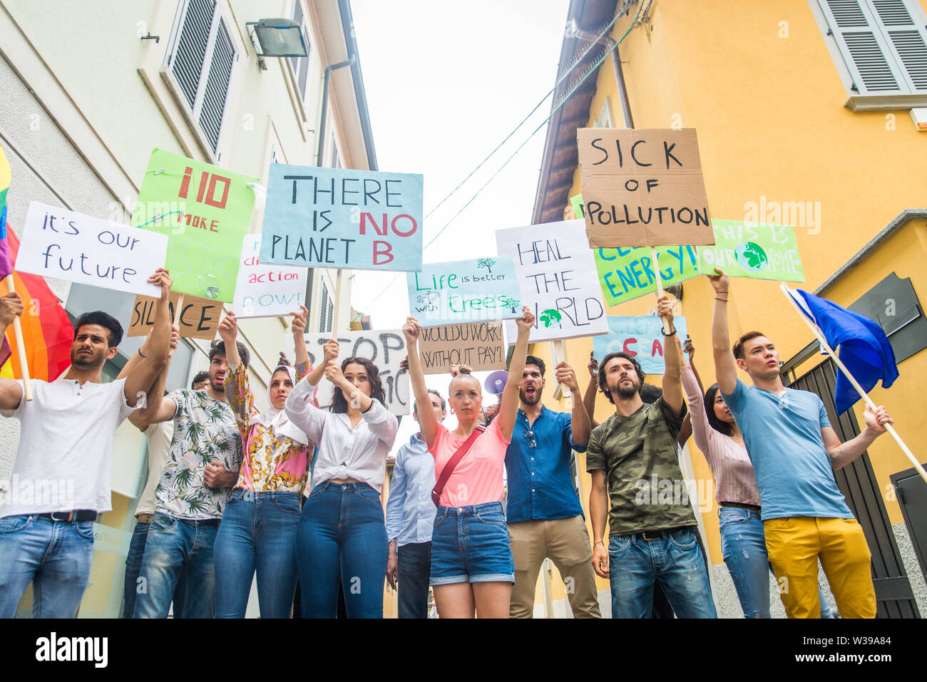 Group of activists is protesting outdoors - Crowd demonstrating against ...