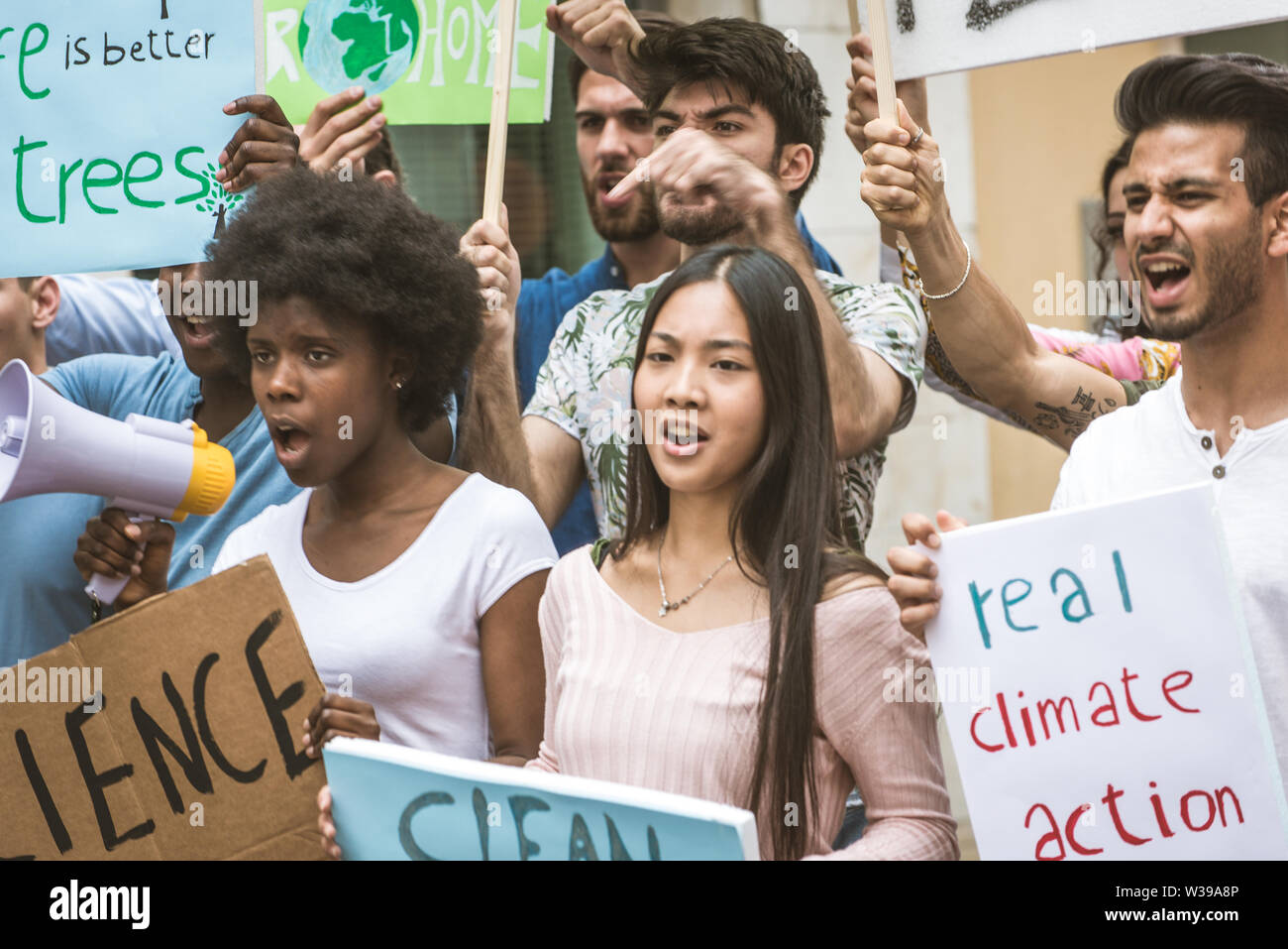 Group of activists is protesting outdoors - Crowd demonstrating against ...