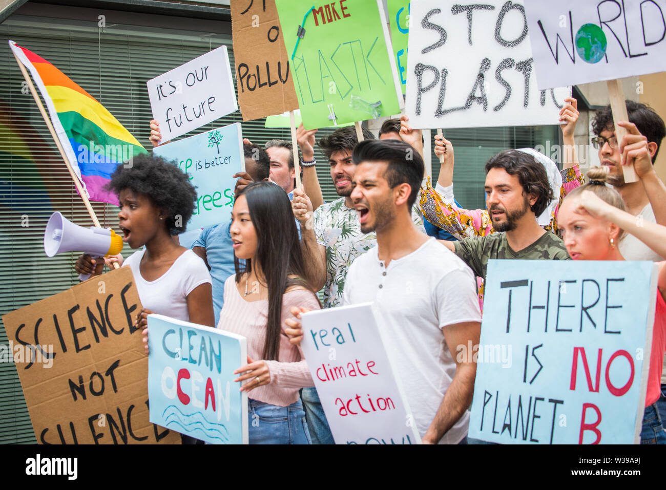Group of activists is protesting outdoors - Crowd demonstrating against ...