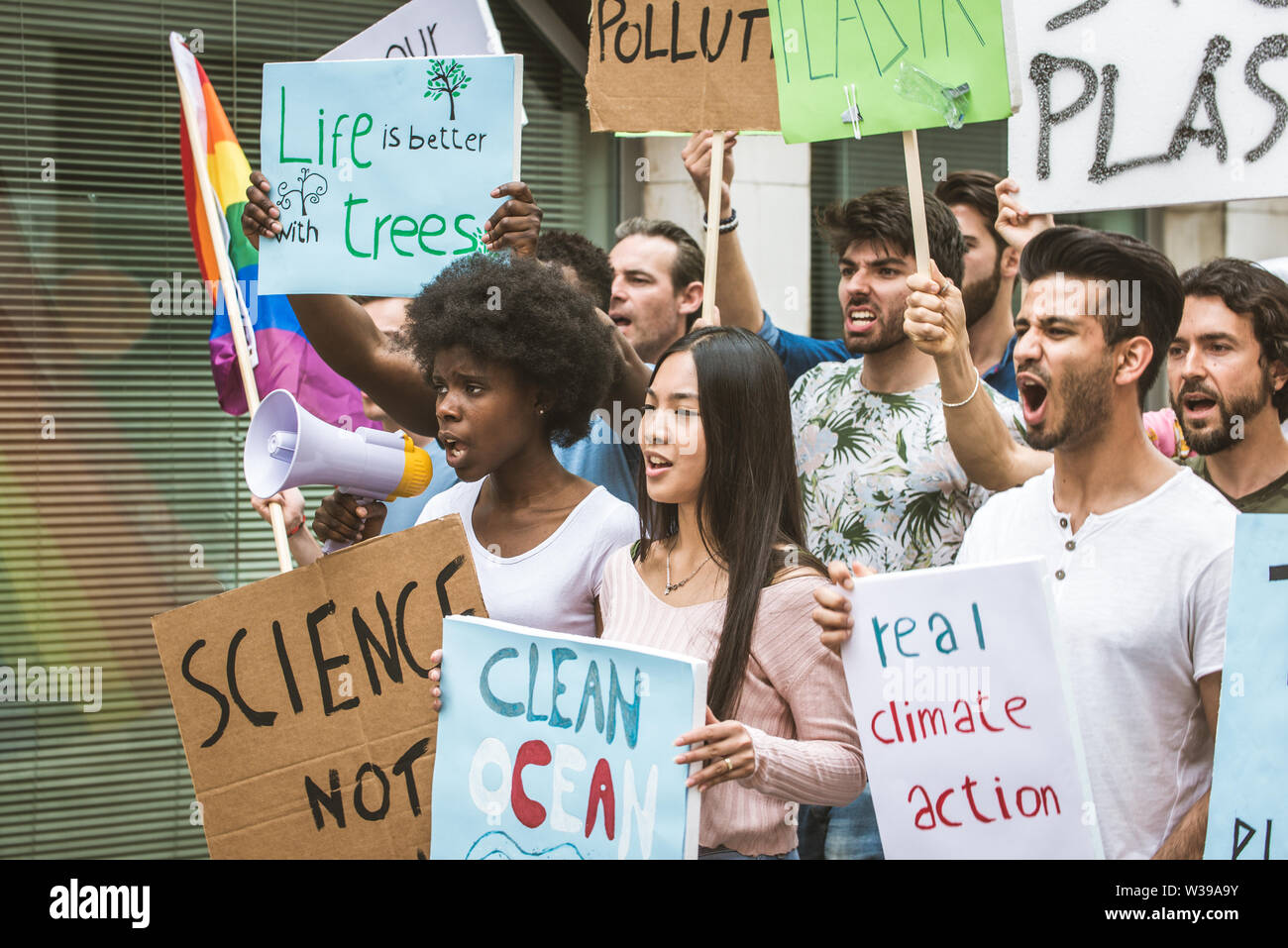 Group of activists is protesting outdoors - Crowd demonstrating against ...