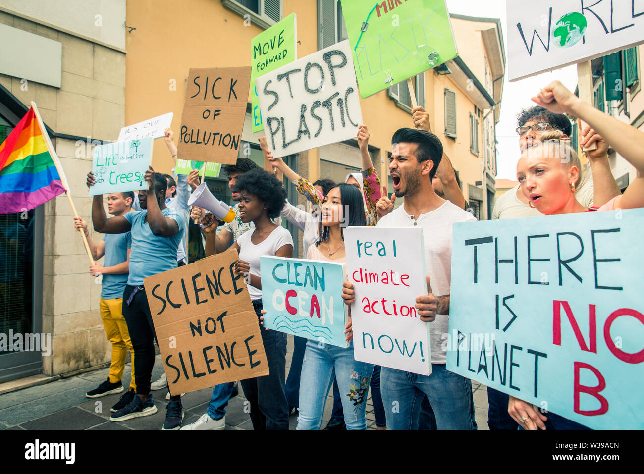 Group of activists is protesting outdoors - Crowd demonstrating against ...