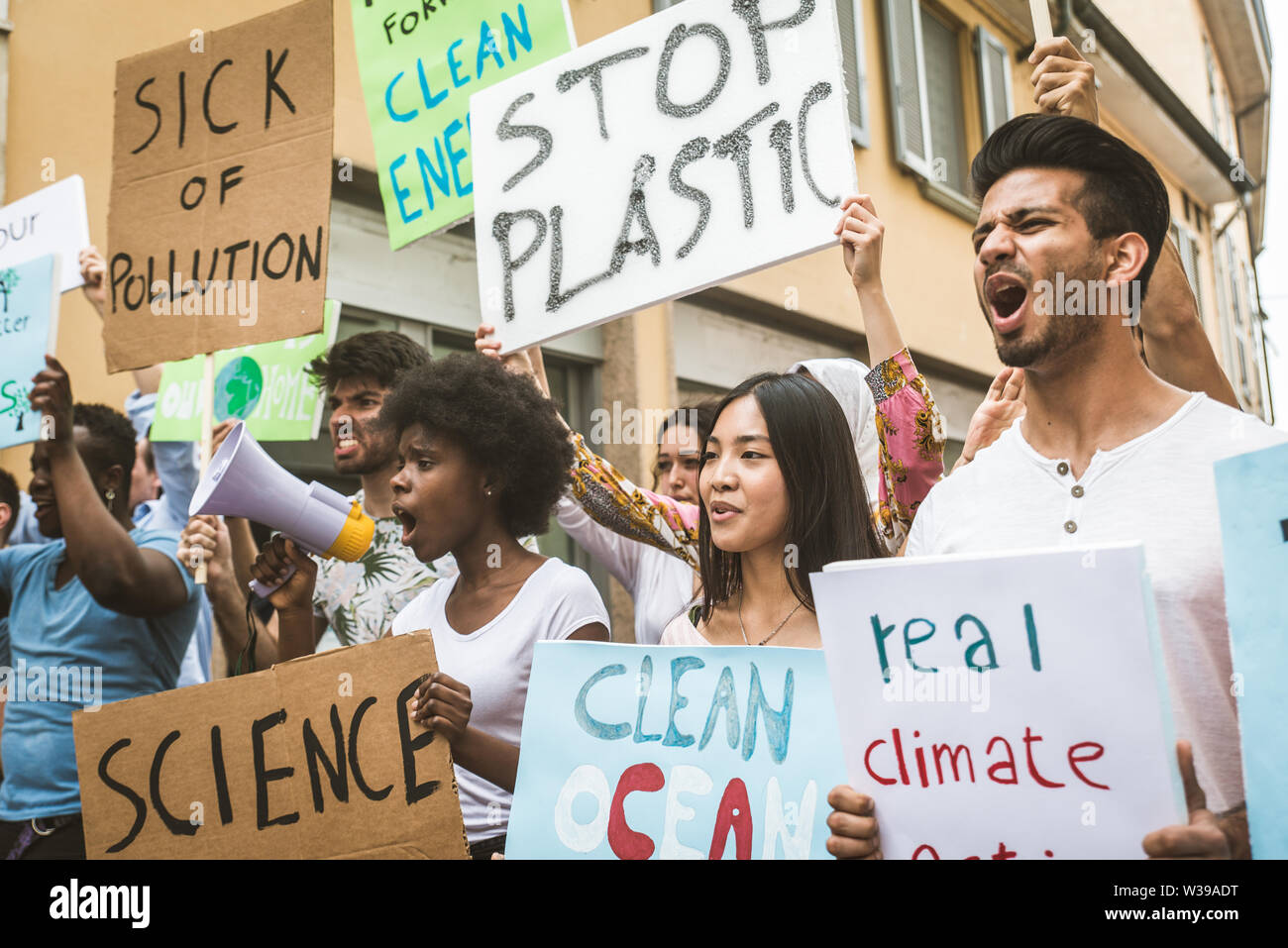 Group of activists is protesting outdoors - Crowd demonstrating against ...