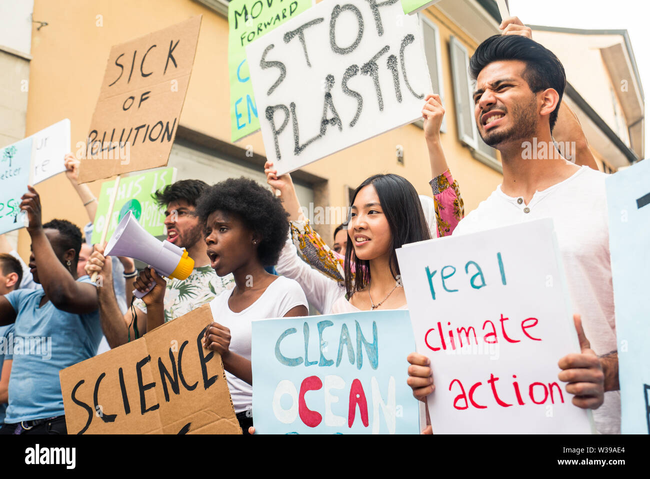 Group of activists is protesting outdoors - Crowd demonstrating against ...