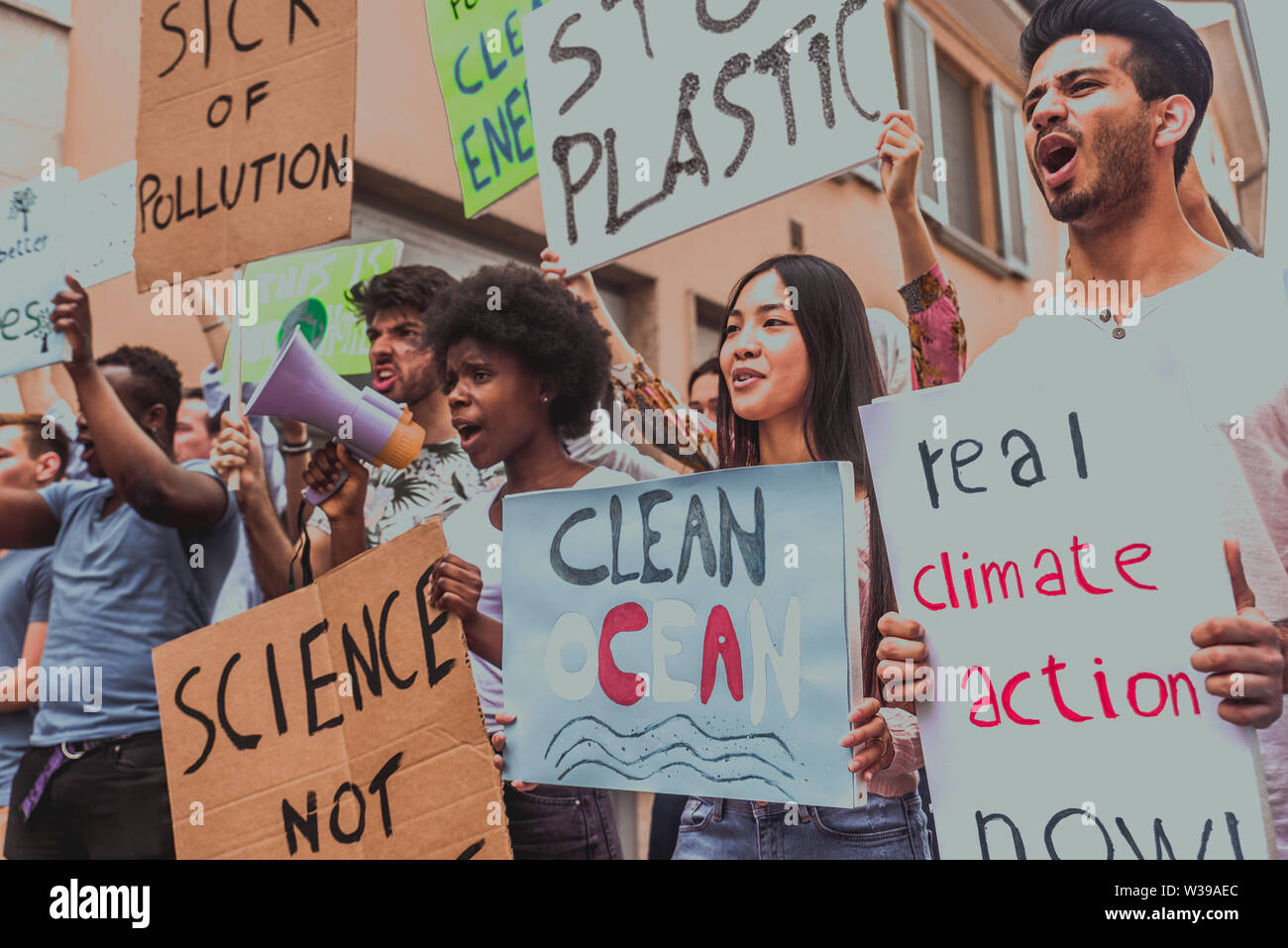 Group of activists is protesting outdoors - Crowd demonstrating against ...