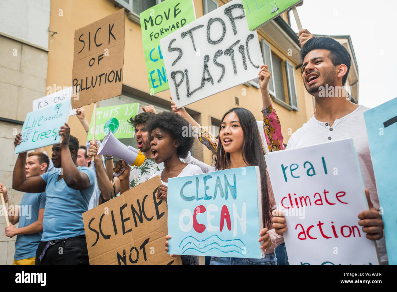 Group of activists is protesting outdoors - Crowd demonstrating against ...