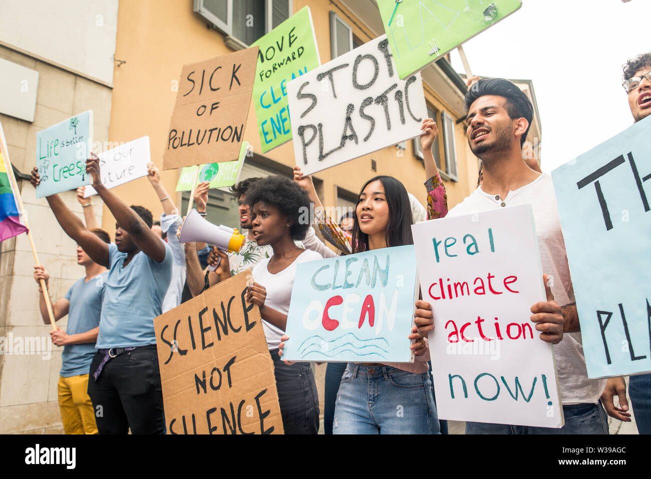 Group of activists is protesting outdoors - Crowd demonstrating against ...