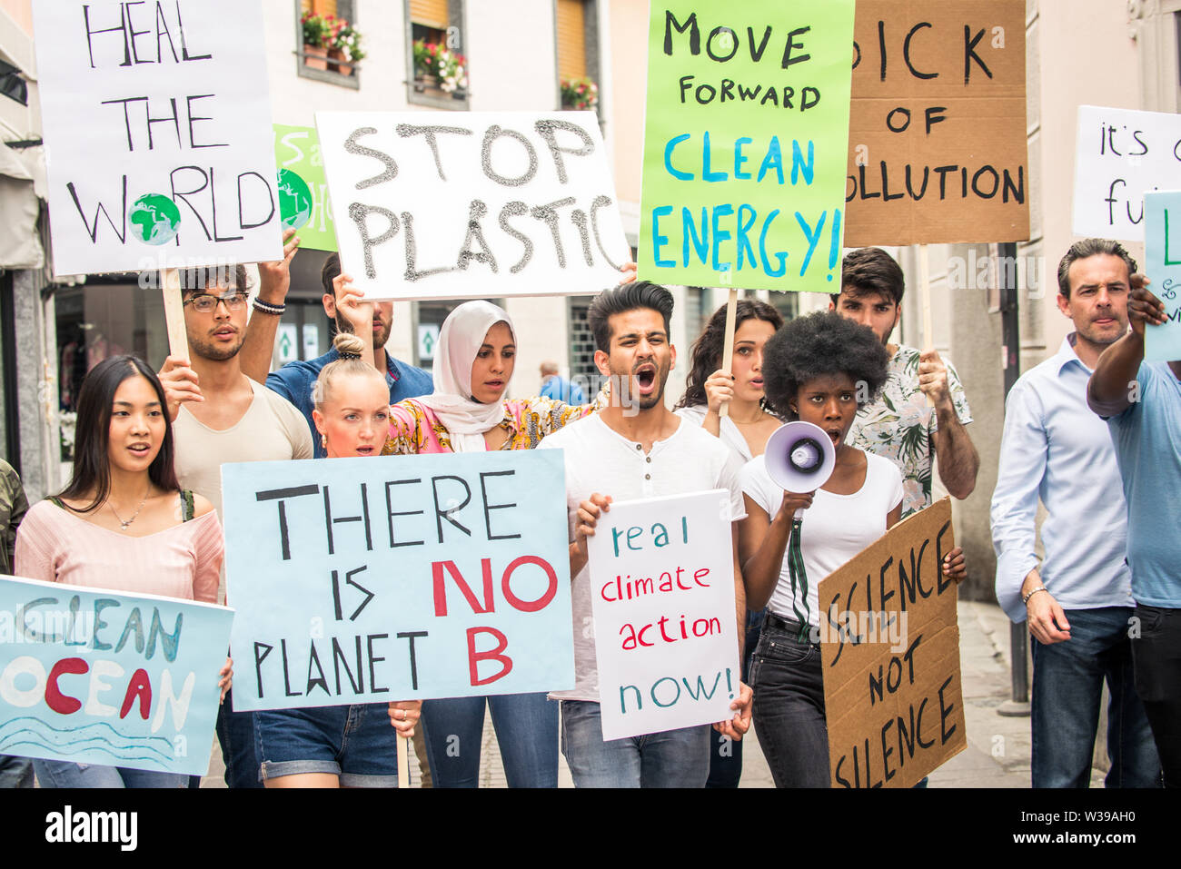 Group of activists is protesting outdoors - Crowd demonstrating against ...