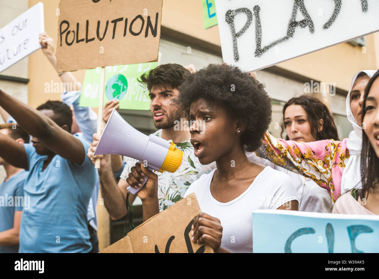 Group of activists is protesting outdoors - Crowd demonstrating against ...