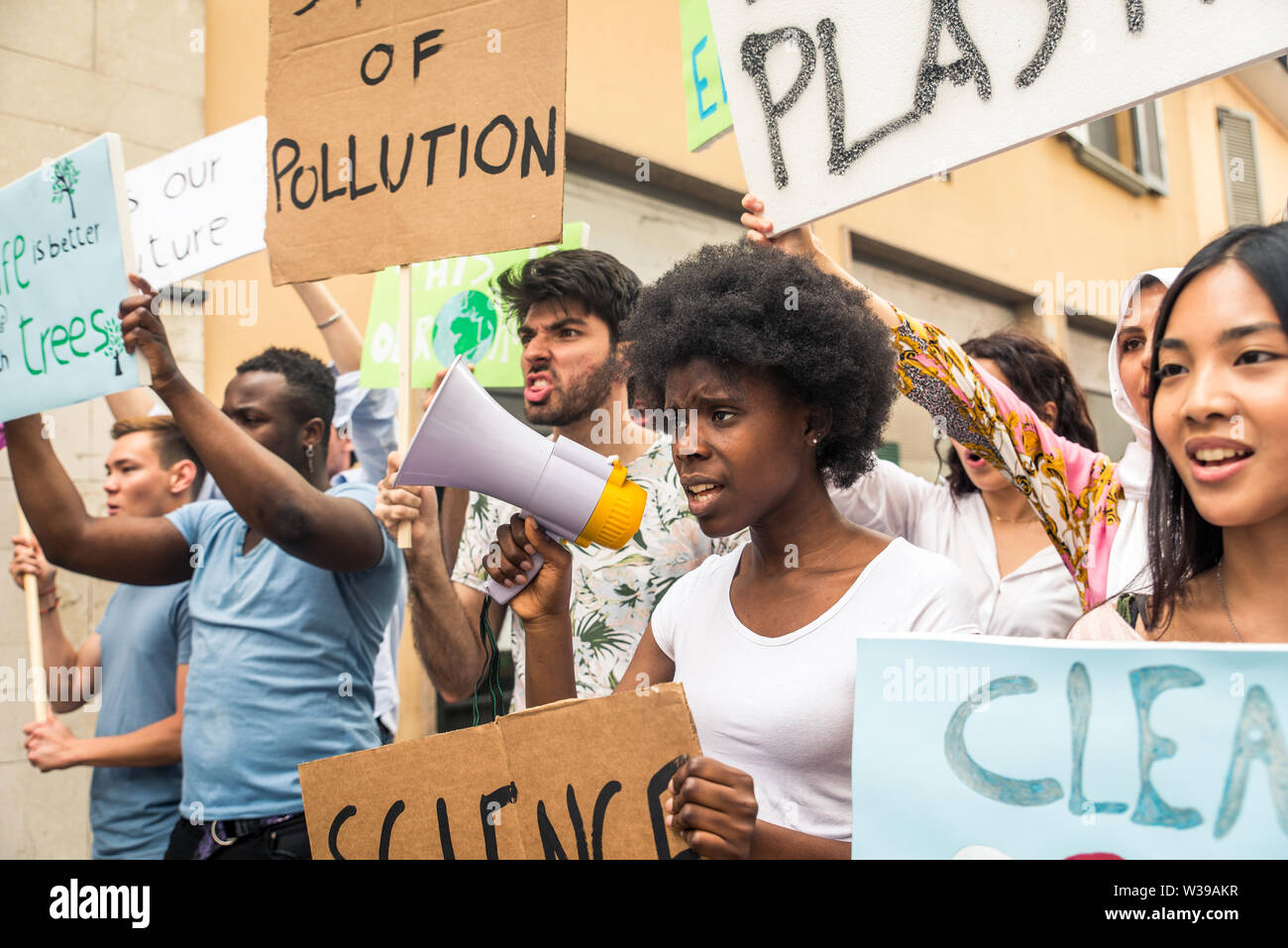 Group of activists is protesting outdoors - Crowd demonstrating against ...