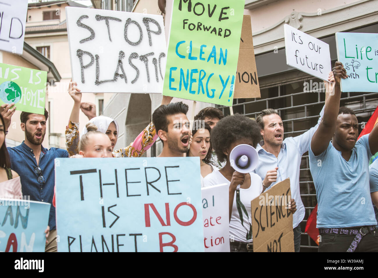 Group of activists is protesting outdoors - Crowd demonstrating against ...
