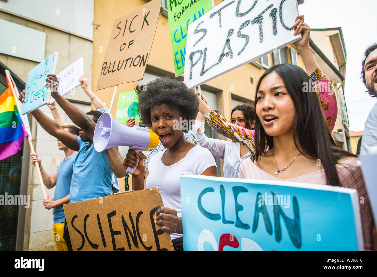 Group of activists is protesting outdoors - Crowd demonstrating against ...