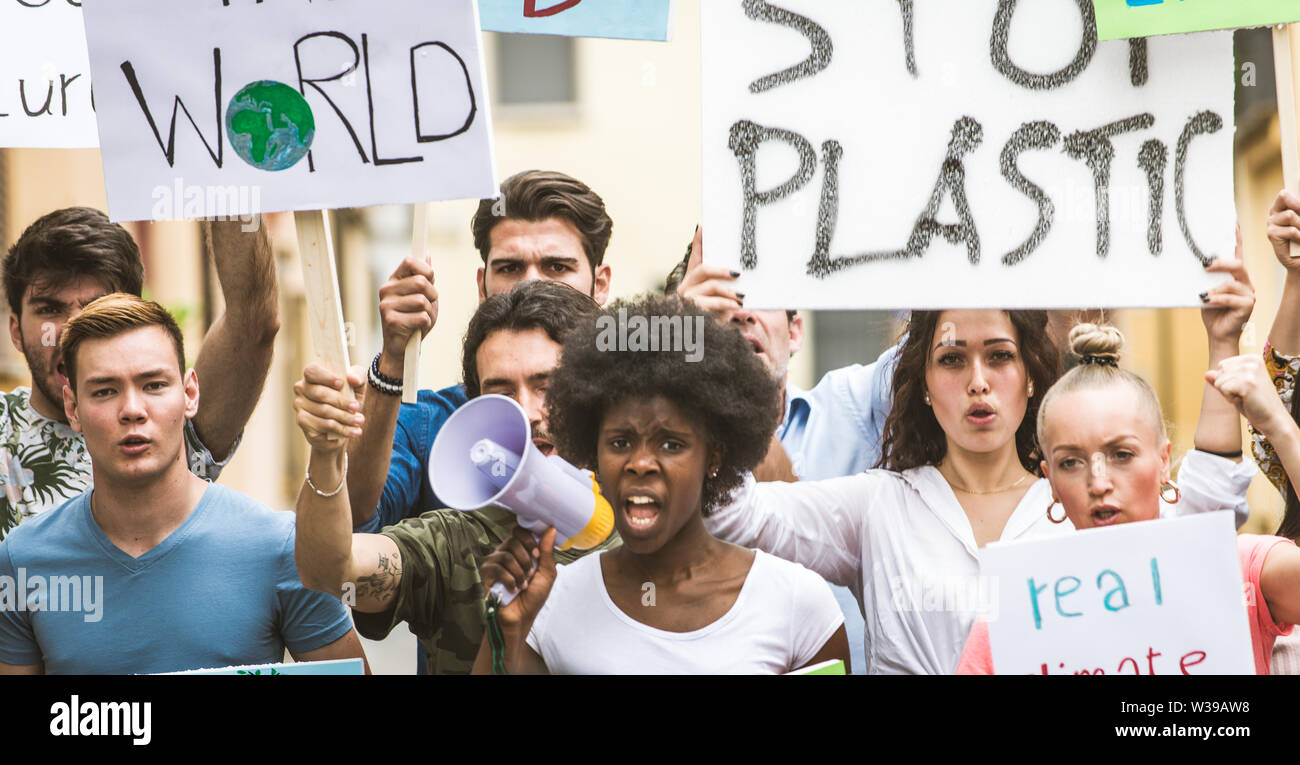 Group of activists is protesting outdoors - Crowd demonstrating against ...
