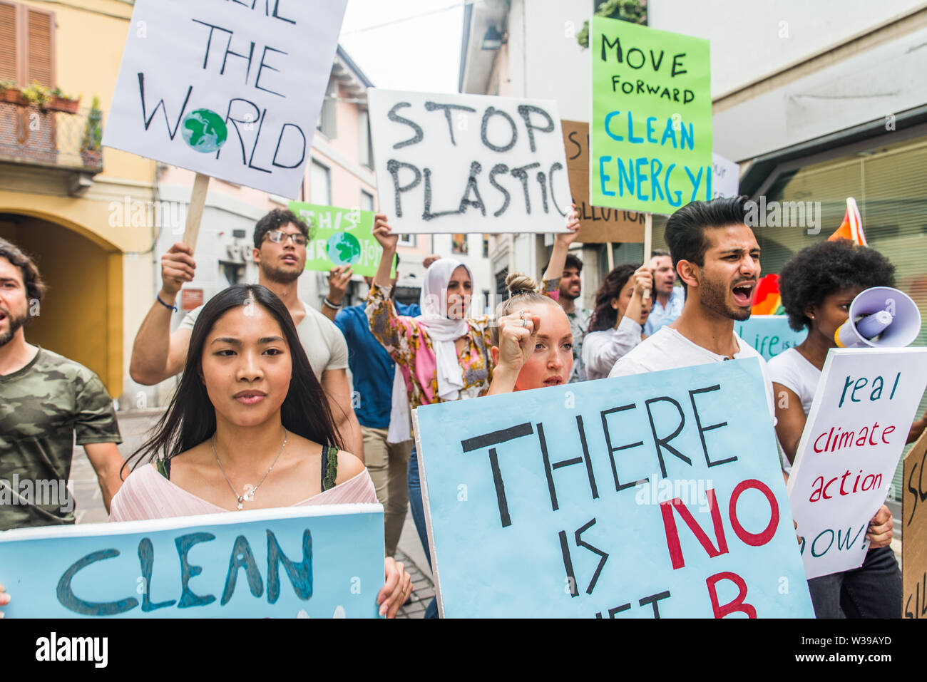 Group of activists is protesting outdoors - Crowd demonstrating against ...