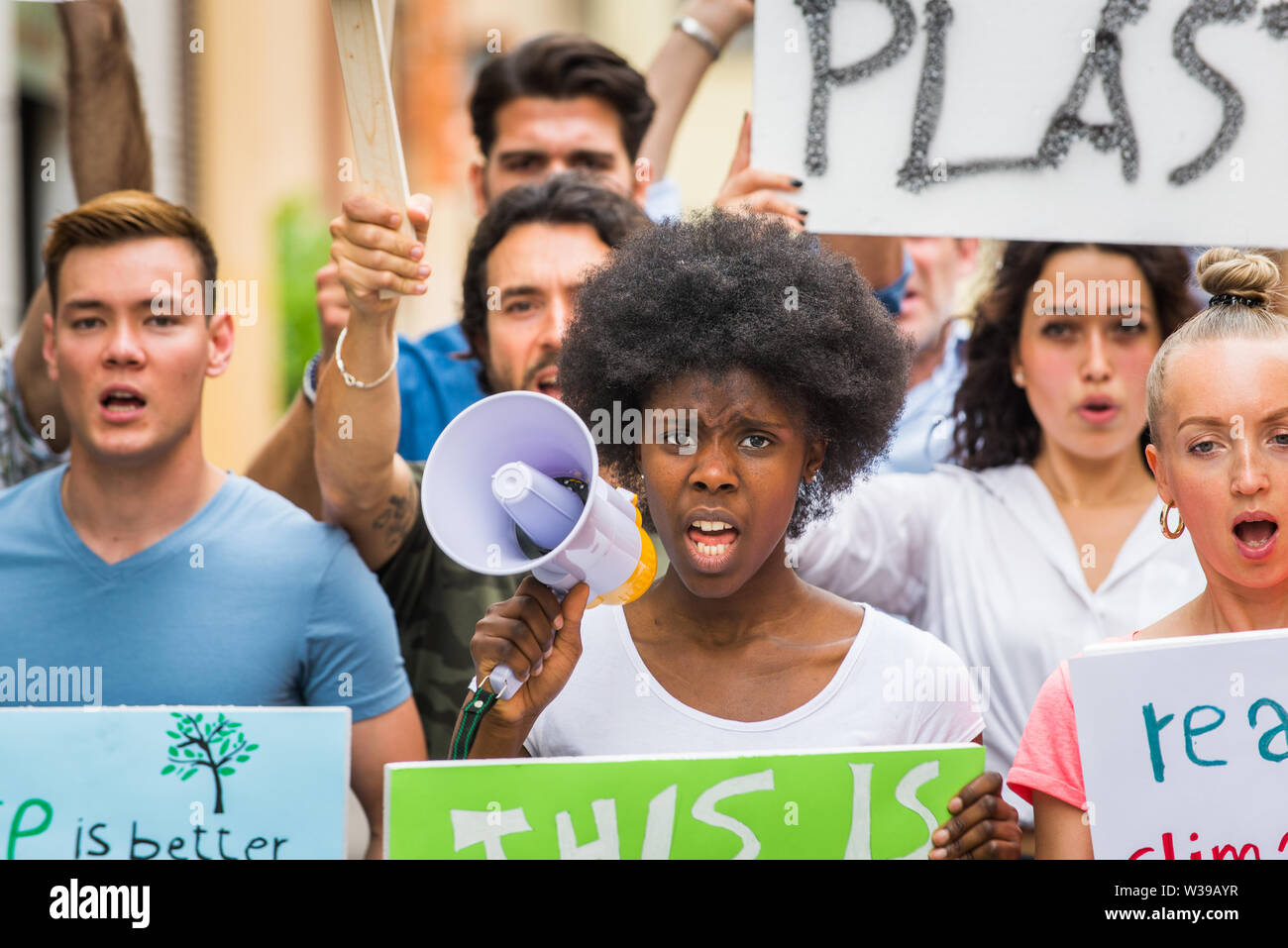 Group of activists is protesting outdoors - Crowd demonstrating against ...