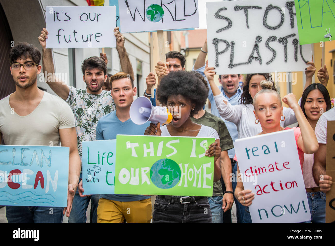 Group of activists is protesting outdoors - Crowd demonstrating against ...
