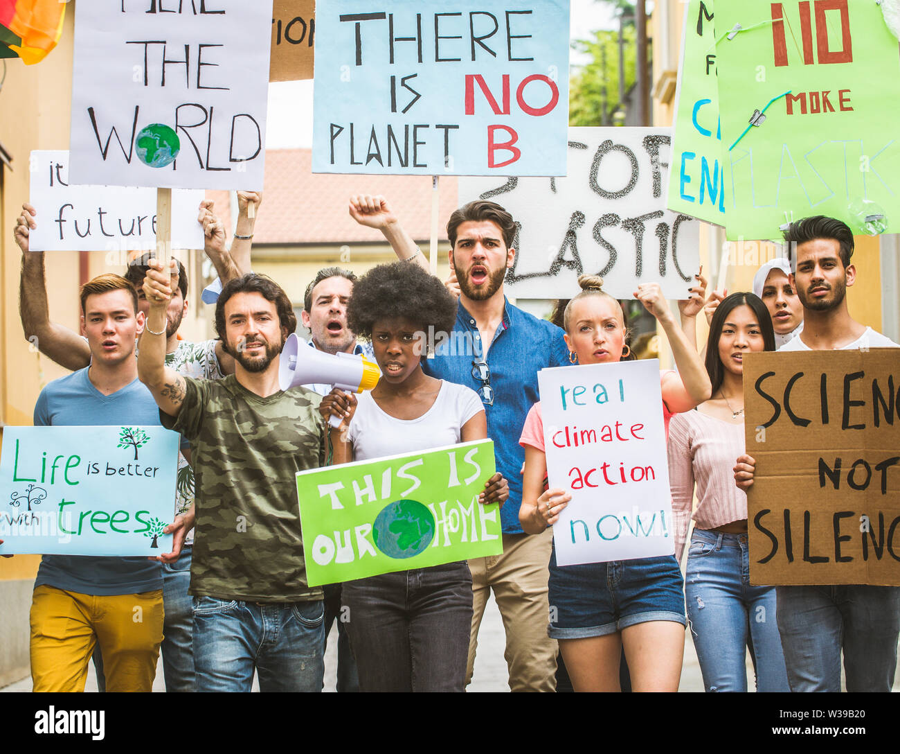 Group of activists is protesting outdoors - Crowd demonstrating against ...