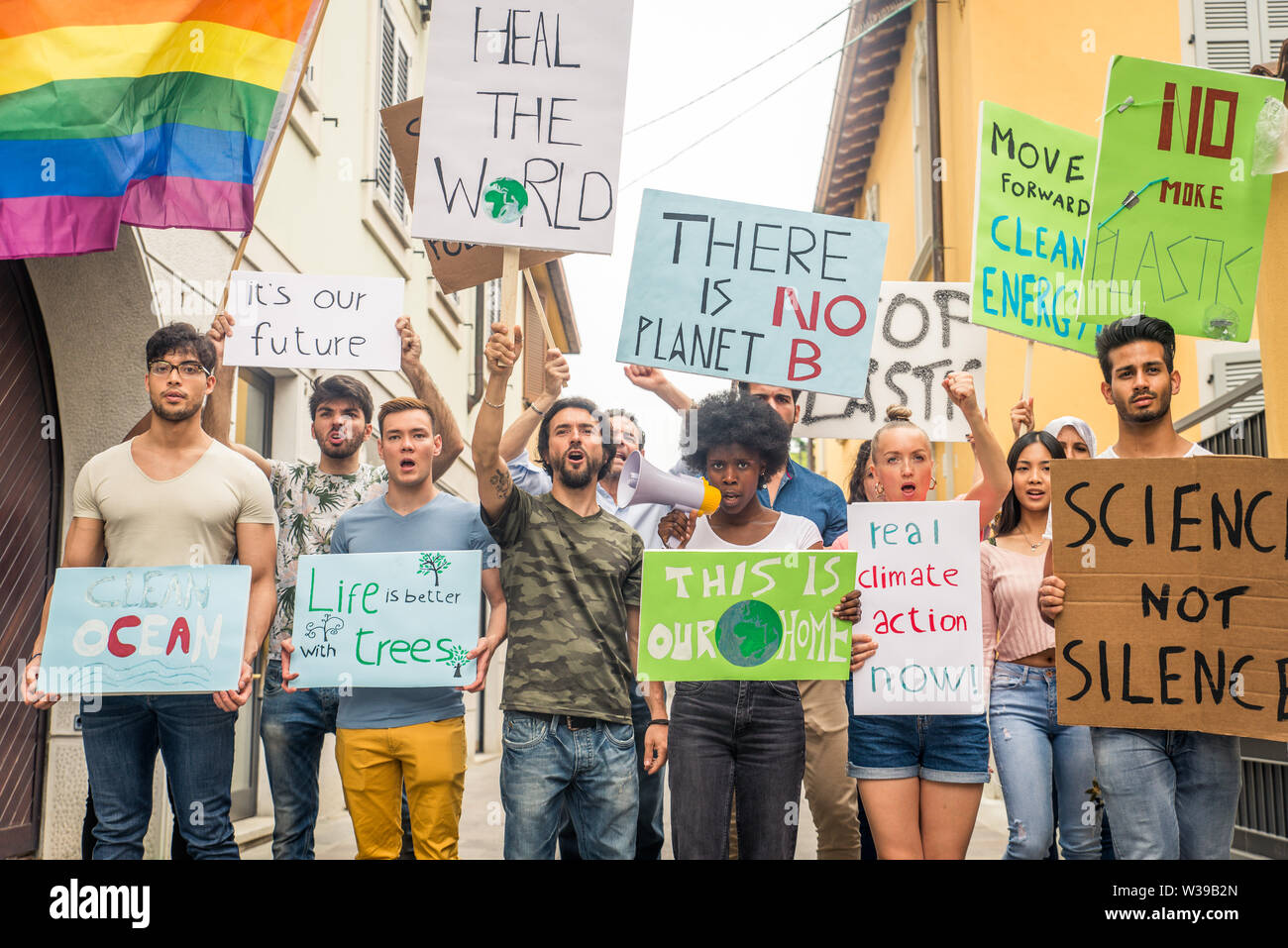 Group of activists is protesting outdoors - Crowd demonstrating against ...