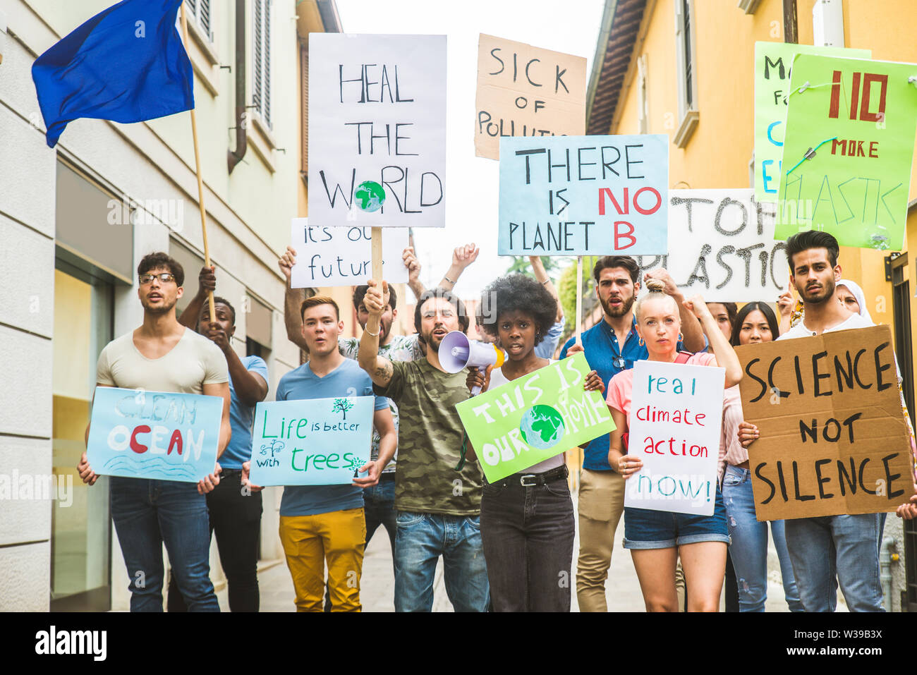 Group of activists is protesting outdoors - Crowd demonstrating against ...