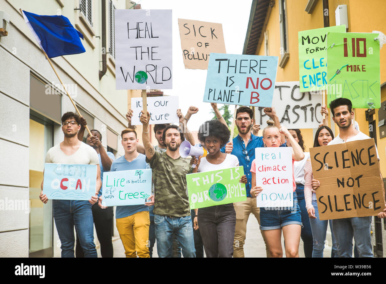 Group of activists is protesting outdoors - Crowd demonstrating against ...