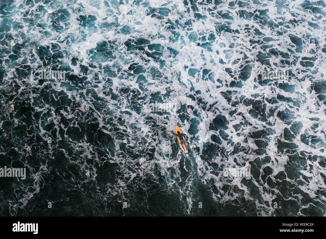 Surfer at Clpud 9 pier in Siargao, Philippines - Aerial view of surfers ...