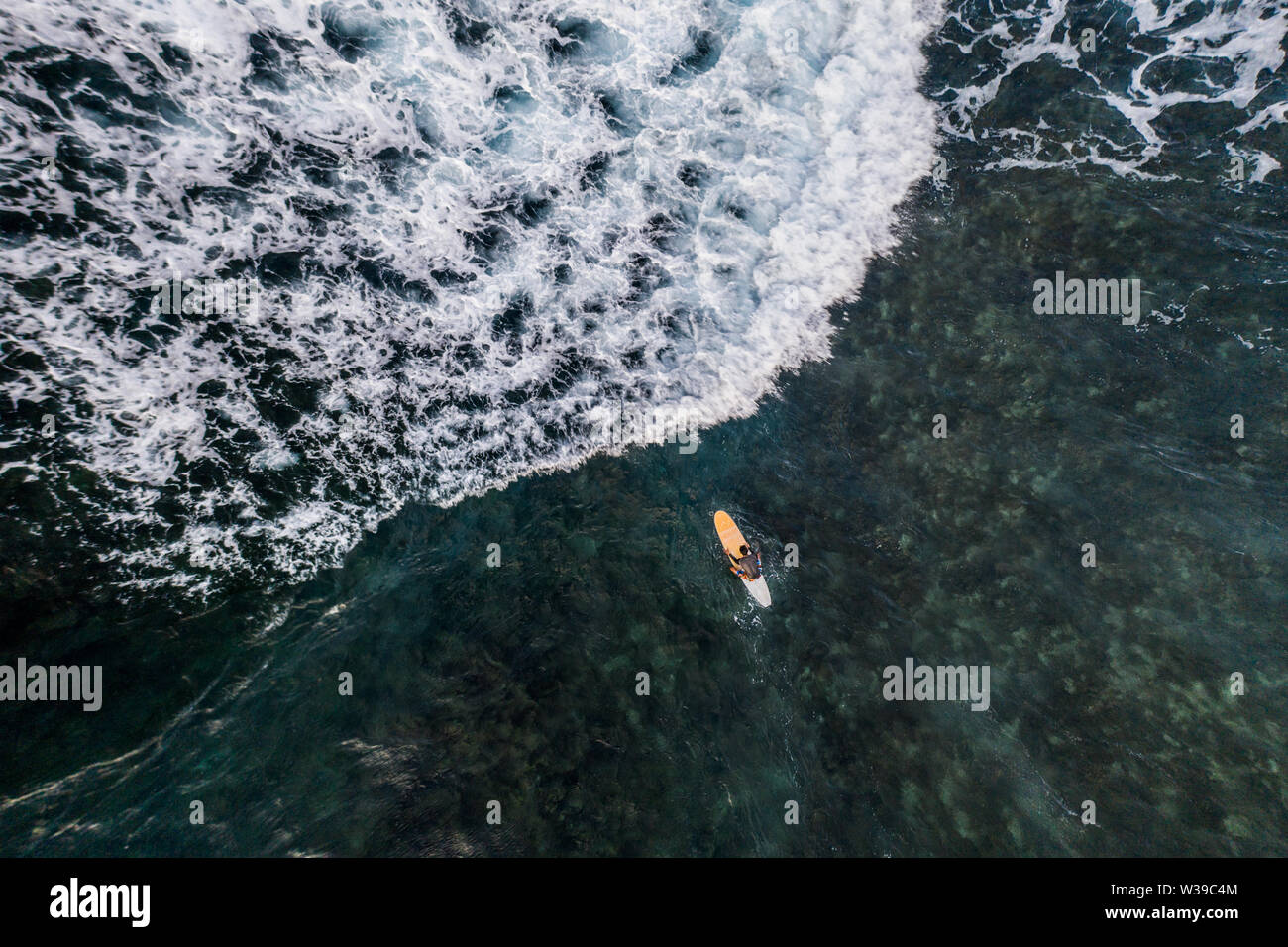 Surfer at Clpud 9 pier in Siargao, Philippines - Aerial view of surfers ...