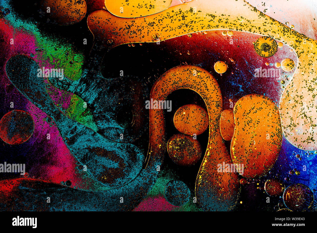 Oil bubbles inside water base form patterns Stock Photo - Alamy