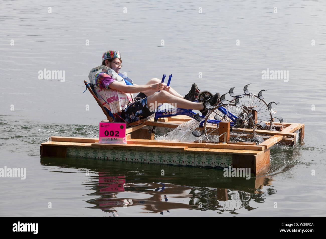 A young man and sole participant in the STEM category, races in the ...