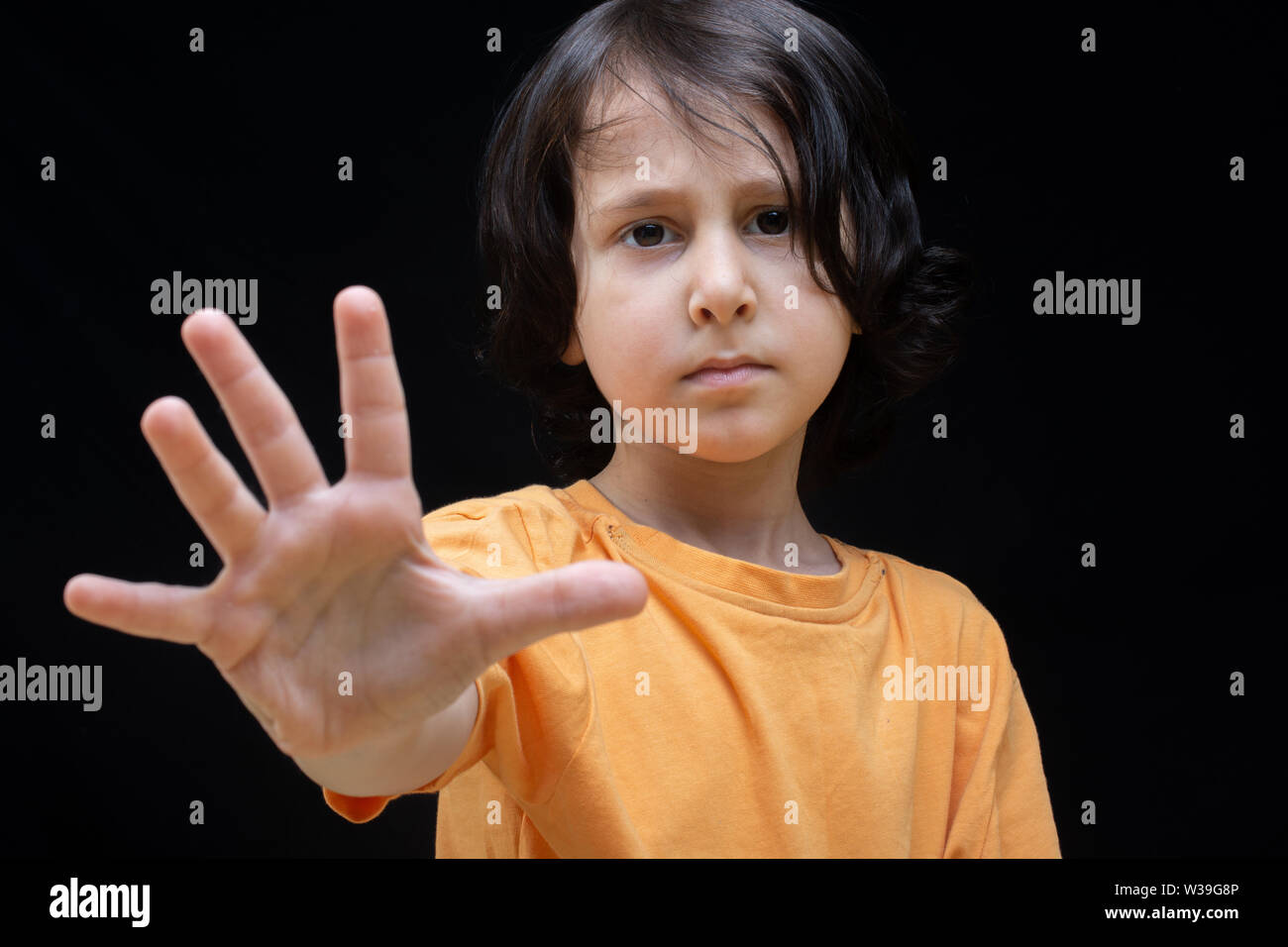 Boy showing stop gesture with his hand as prohibition concept Stock ...