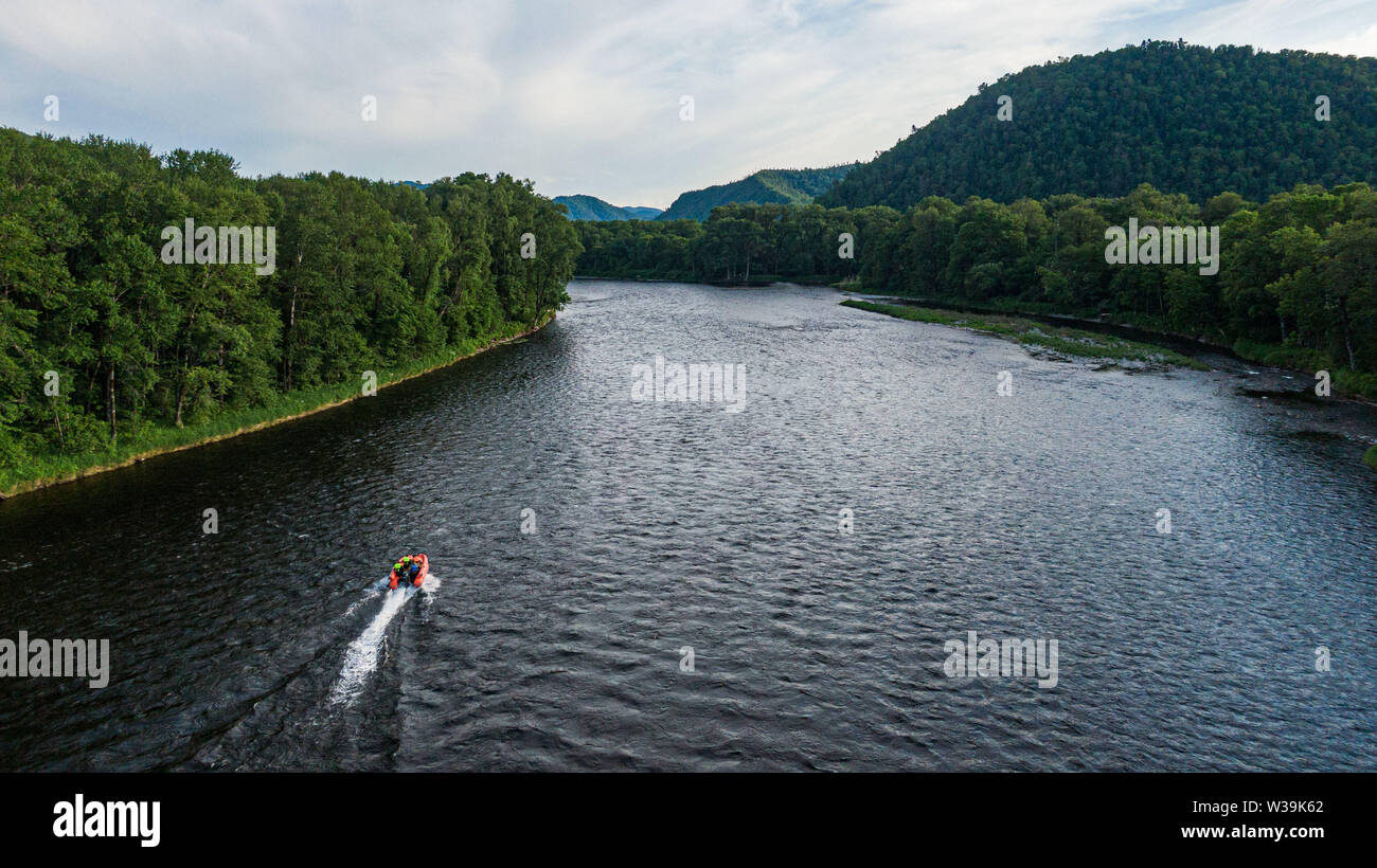 inflatable motor boat. fishing boat on a mountain river. Anyui River ...