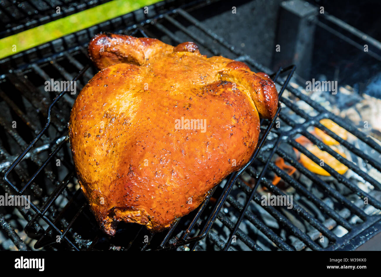 Grilled chicken of delicious roasted in the flaming grill Stock Photo ...