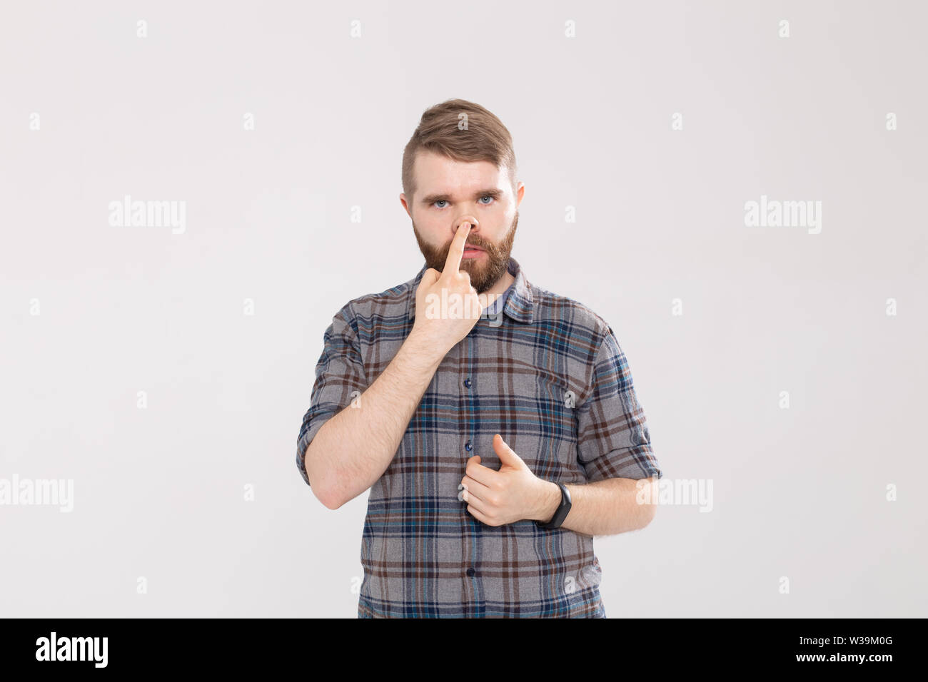 Handsome man shows crazy silly grimace or facial expression, isolated ...