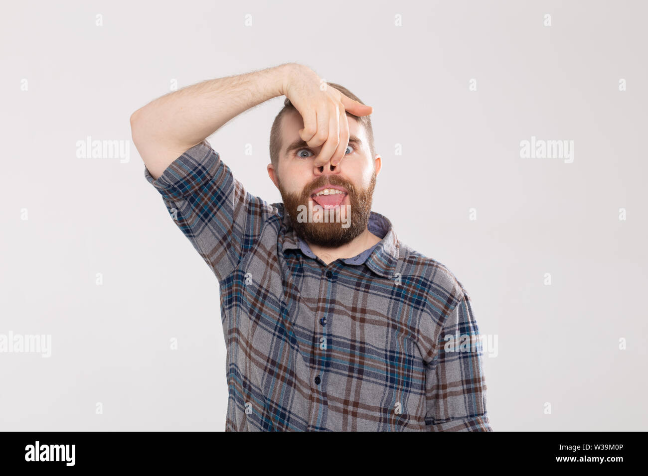 Handsome man shows crazy silly grimace or facial expression, isolated ...