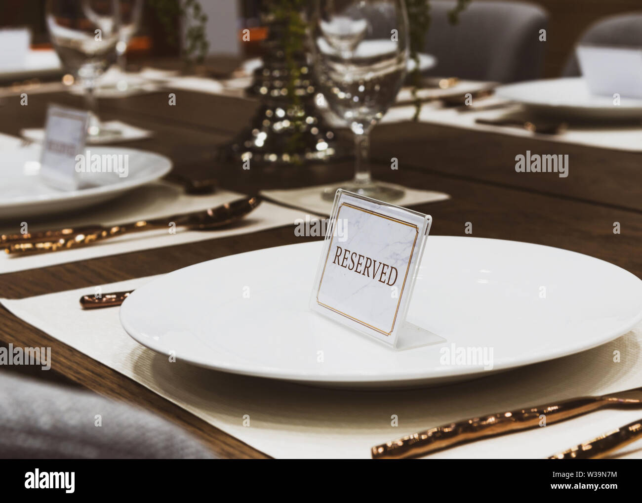 Reservation on a dinner table at the restaurant, plate reserve Stock ...