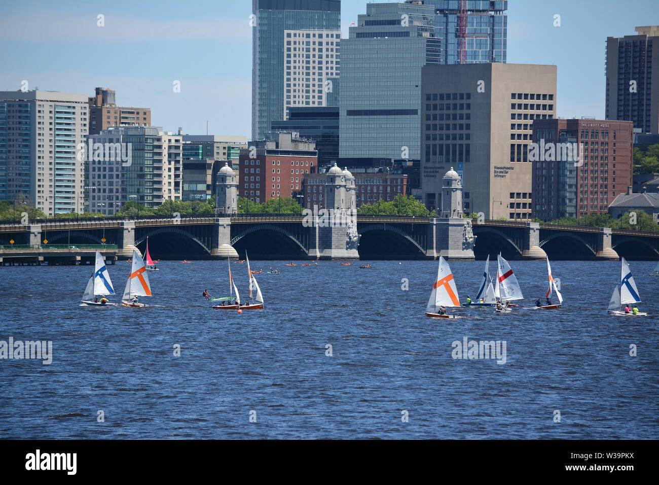 Sailboats sailing in the Charles River Basin with the Boston skyline ...