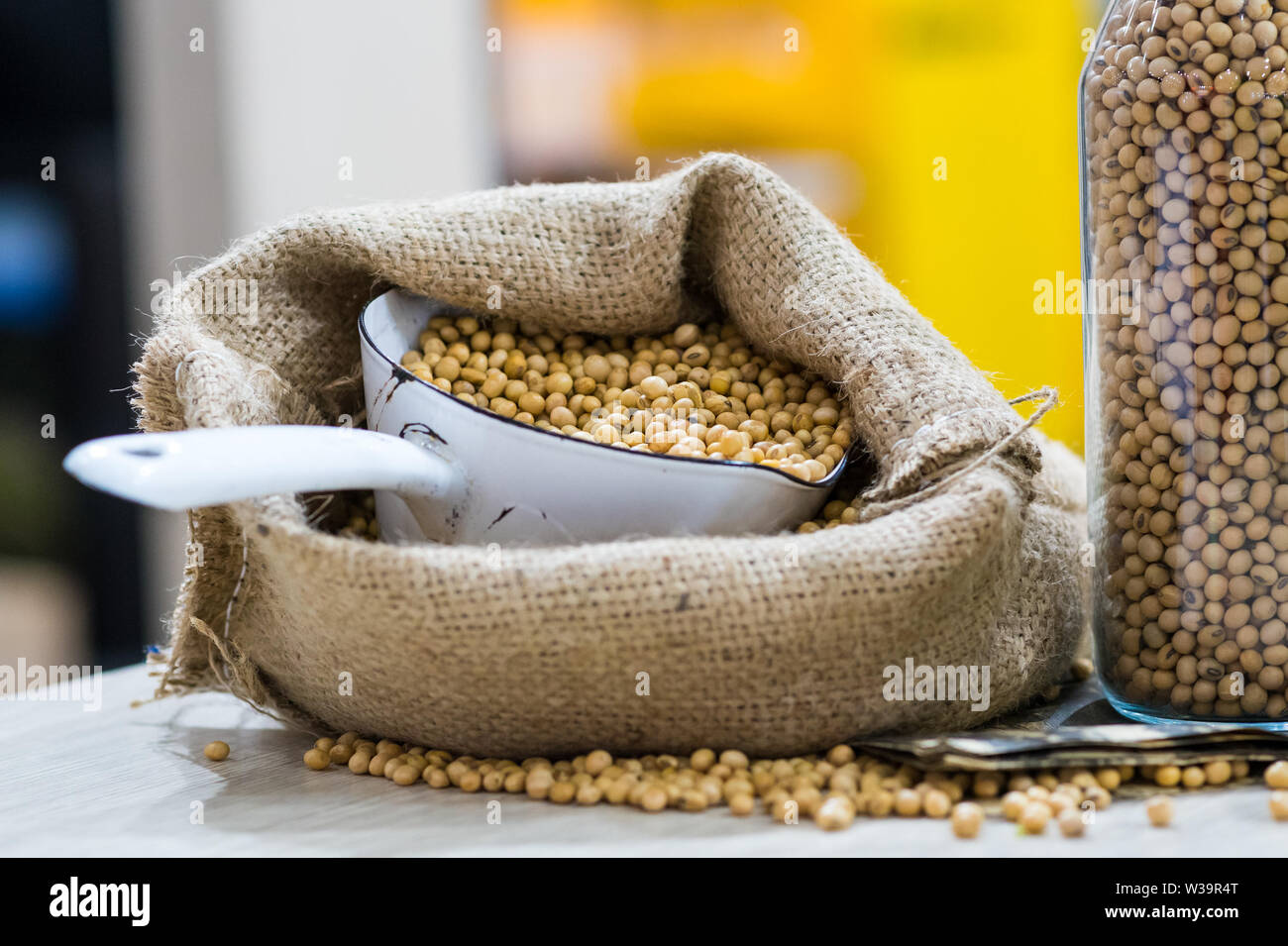 Soybean In sacks on wooden background Stock Photo - Alamy