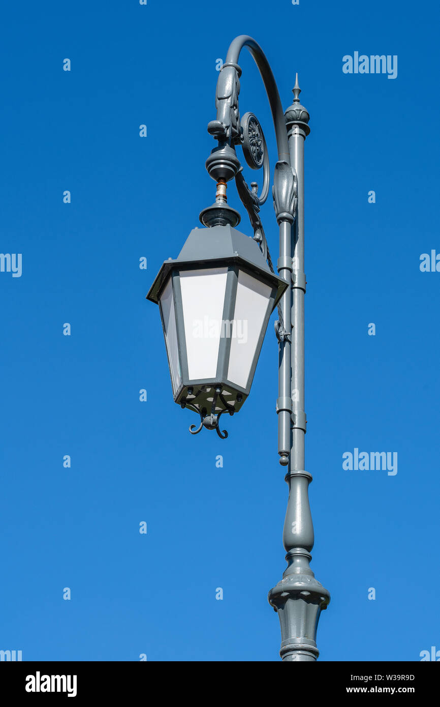 Lamp post with blue sky background, close up. Old fashioned street ...