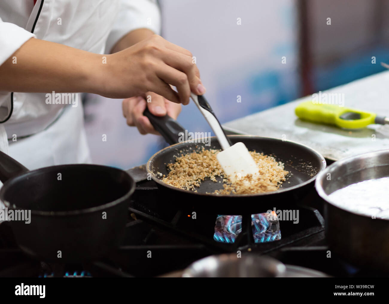 Chef cooking food in the kitchen, Chef preparing food Stock Photo - Alamy