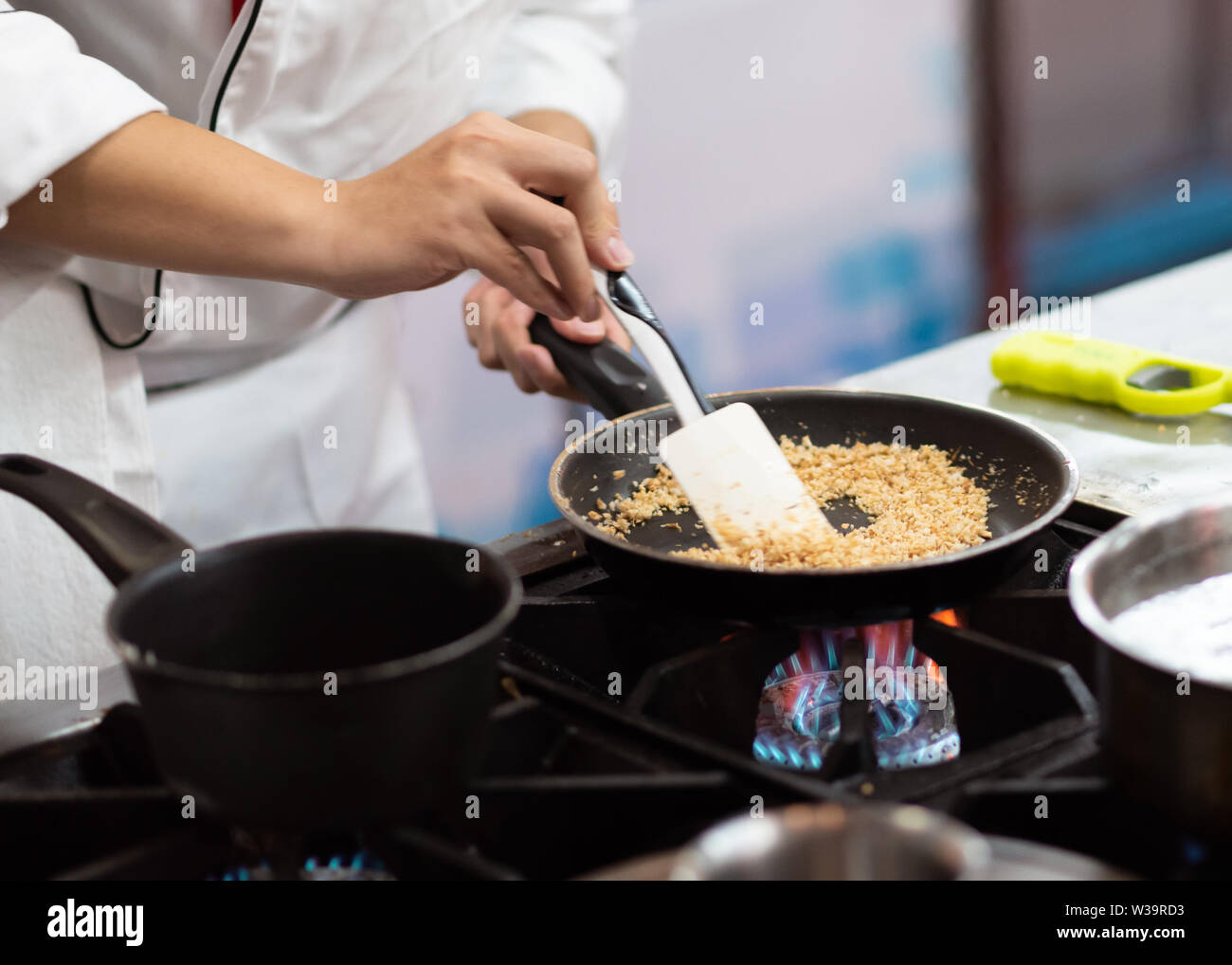 Chef cooking food in the kitchen, Chef preparing food Stock Photo - Alamy