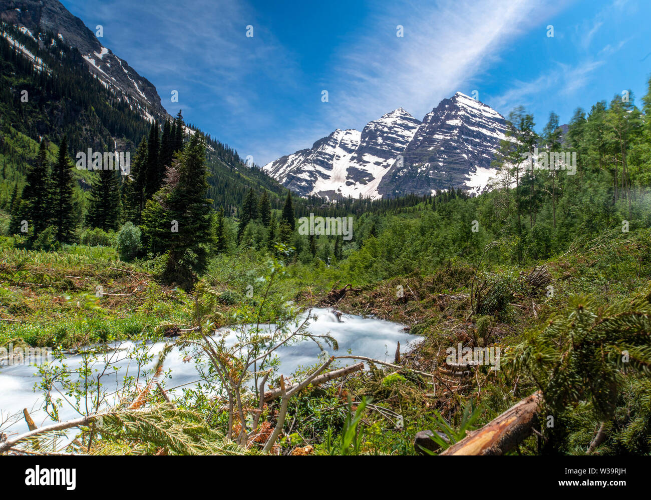 July 04, 2019: Snowmelt runoff rushes towards the valley in front of ...