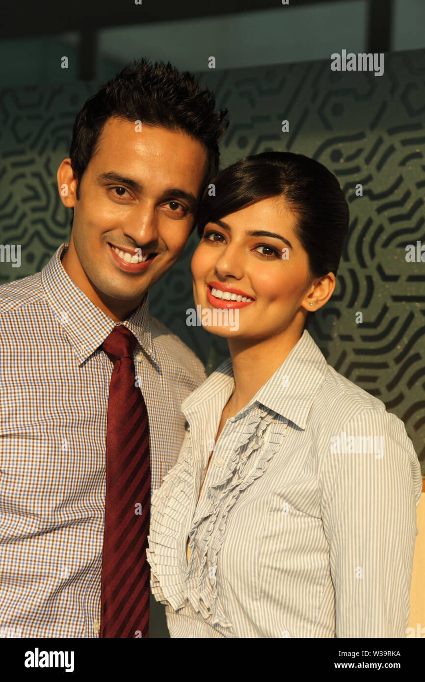 Portrait of two business executives smiling Stock Photo - Alamy