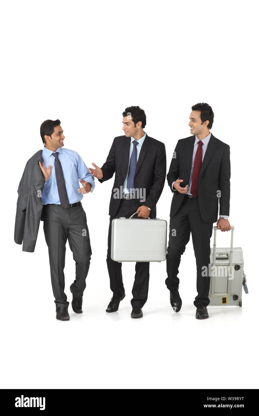 Three business executives discussing Stock Photo - Alamy