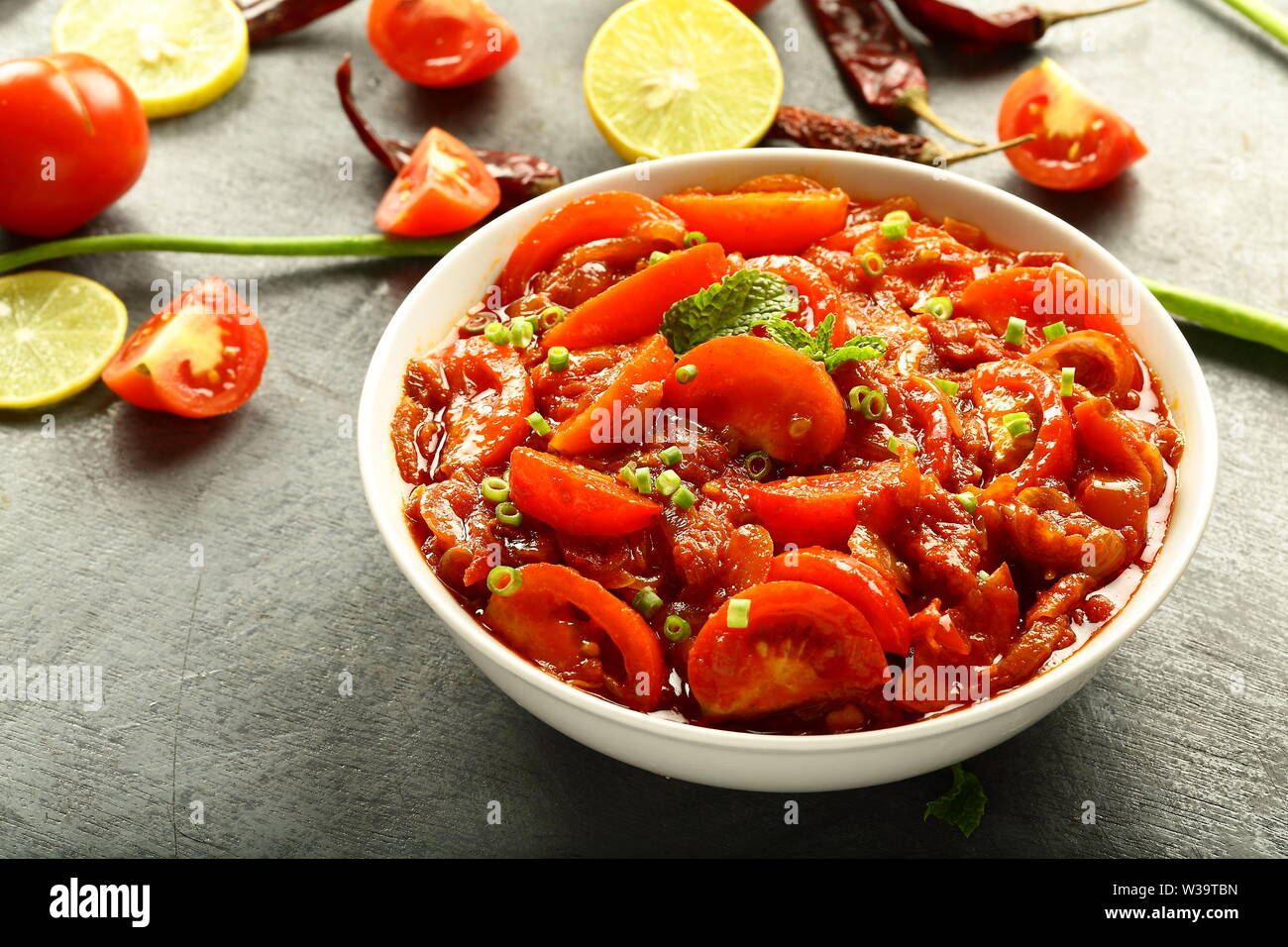 Indian vegan diet food- homemade tomato stir fry Stock Photo - Alamy