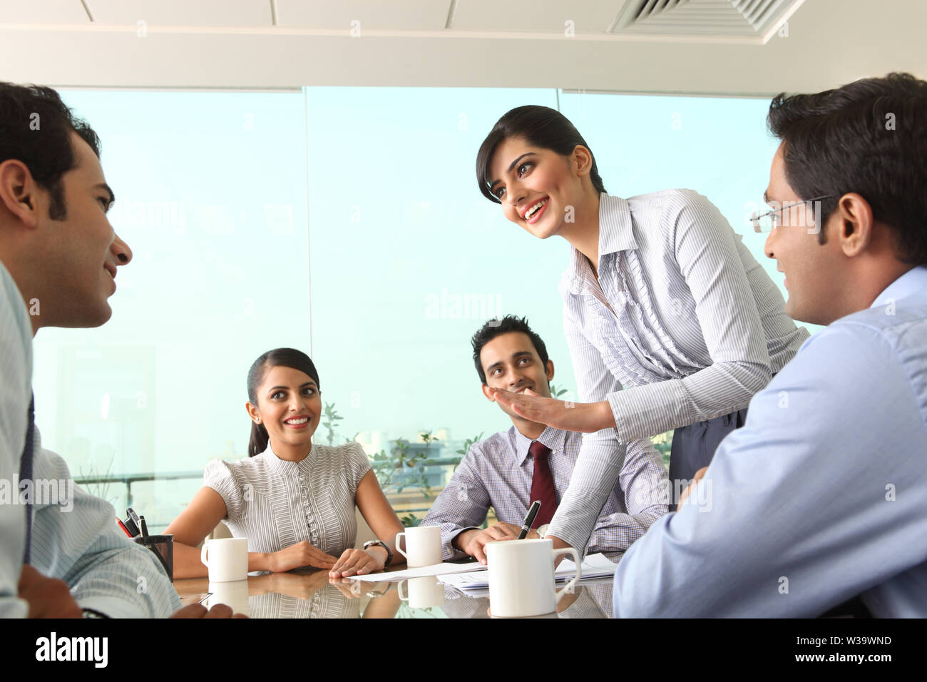 Business executives in an office meeting Stock Photo - Alamy
