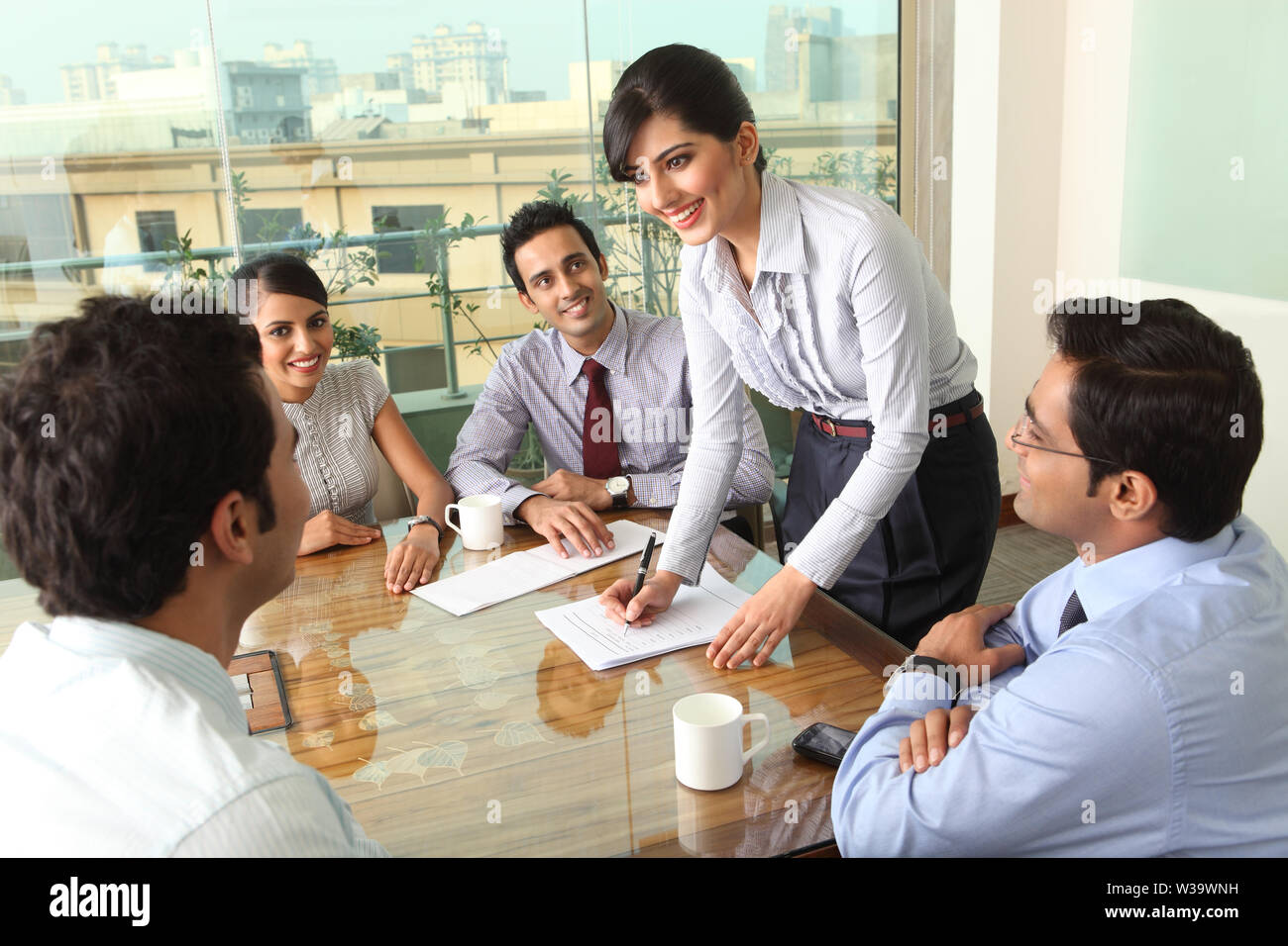 Business executives in an office meeting Stock Photo - Alamy