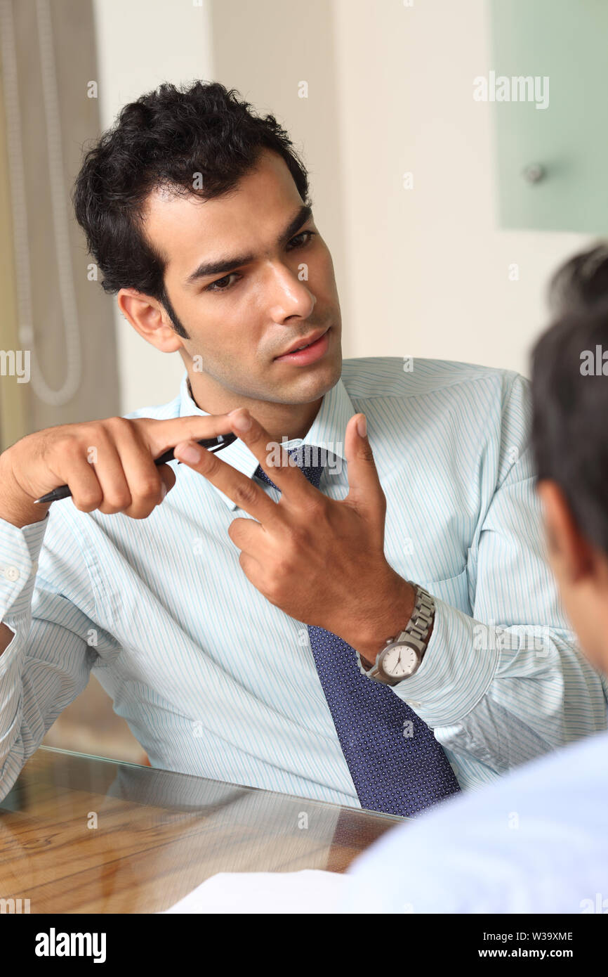 Two business executives discussing in an office Stock Photo - Alamy
